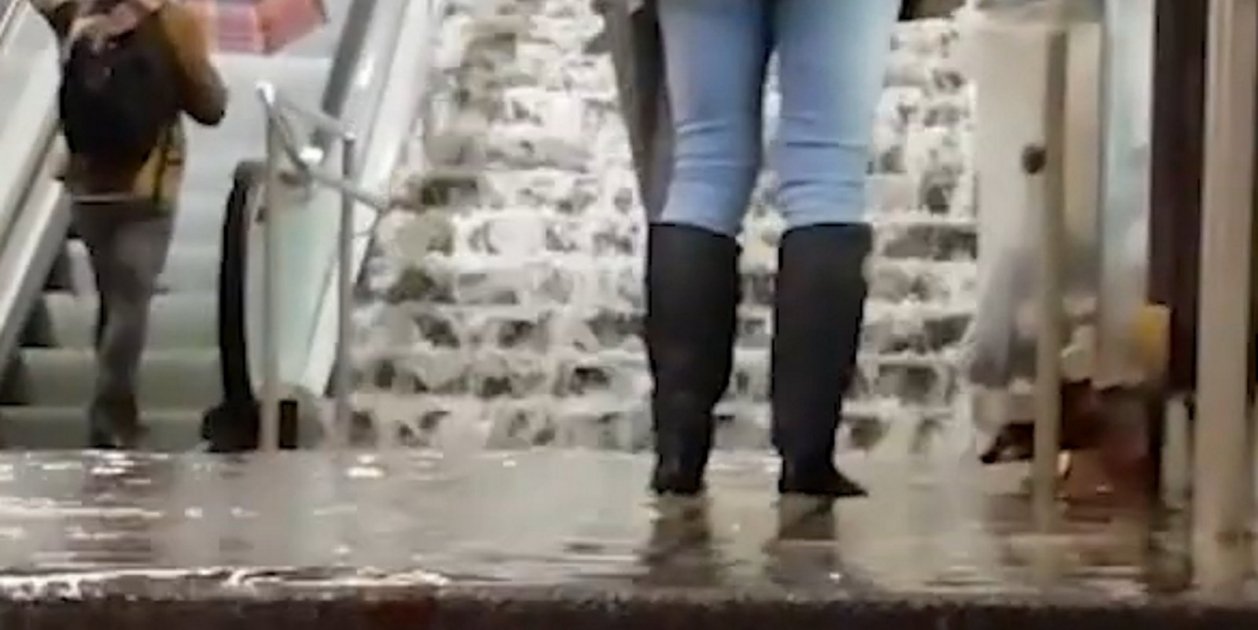 Video: Heavy rain floods Barcelona metro station